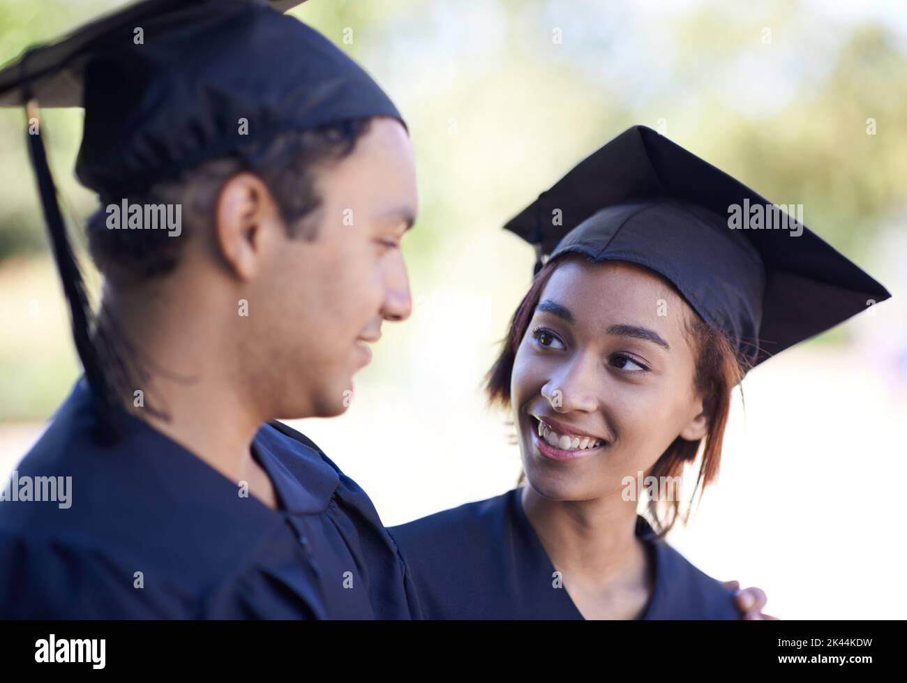 Sharing this life changing moment together. a happy graduate couple in ...