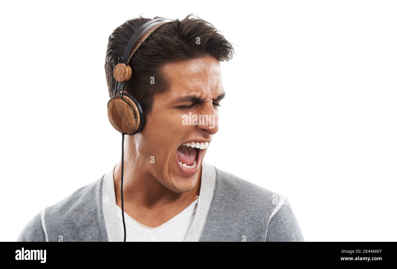 Feeling the groove. A handsome young man enjoying music on his ...