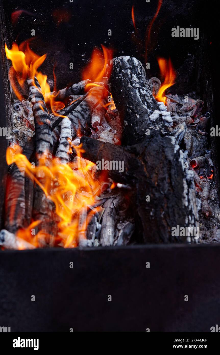 Burning red hot sparks fly from fire. Barbecue gril with glowing and ...