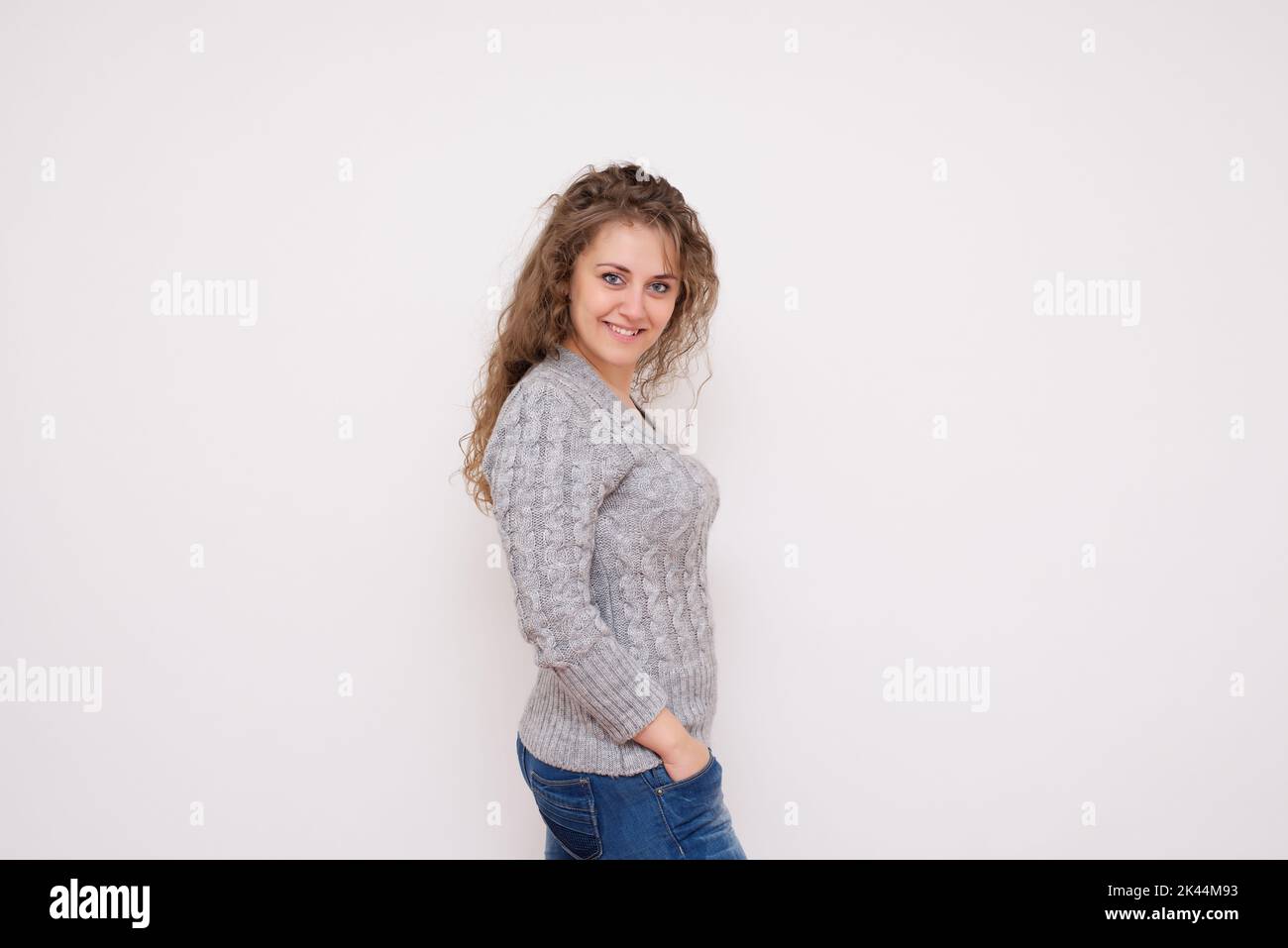 Young woman with curly hair in varioust poses Stock Photo - Alamy