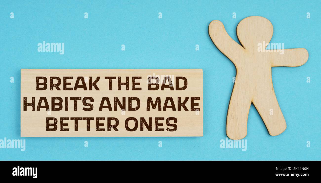 Medicine concept. On a blue background, a wooden figure of a man and a ...