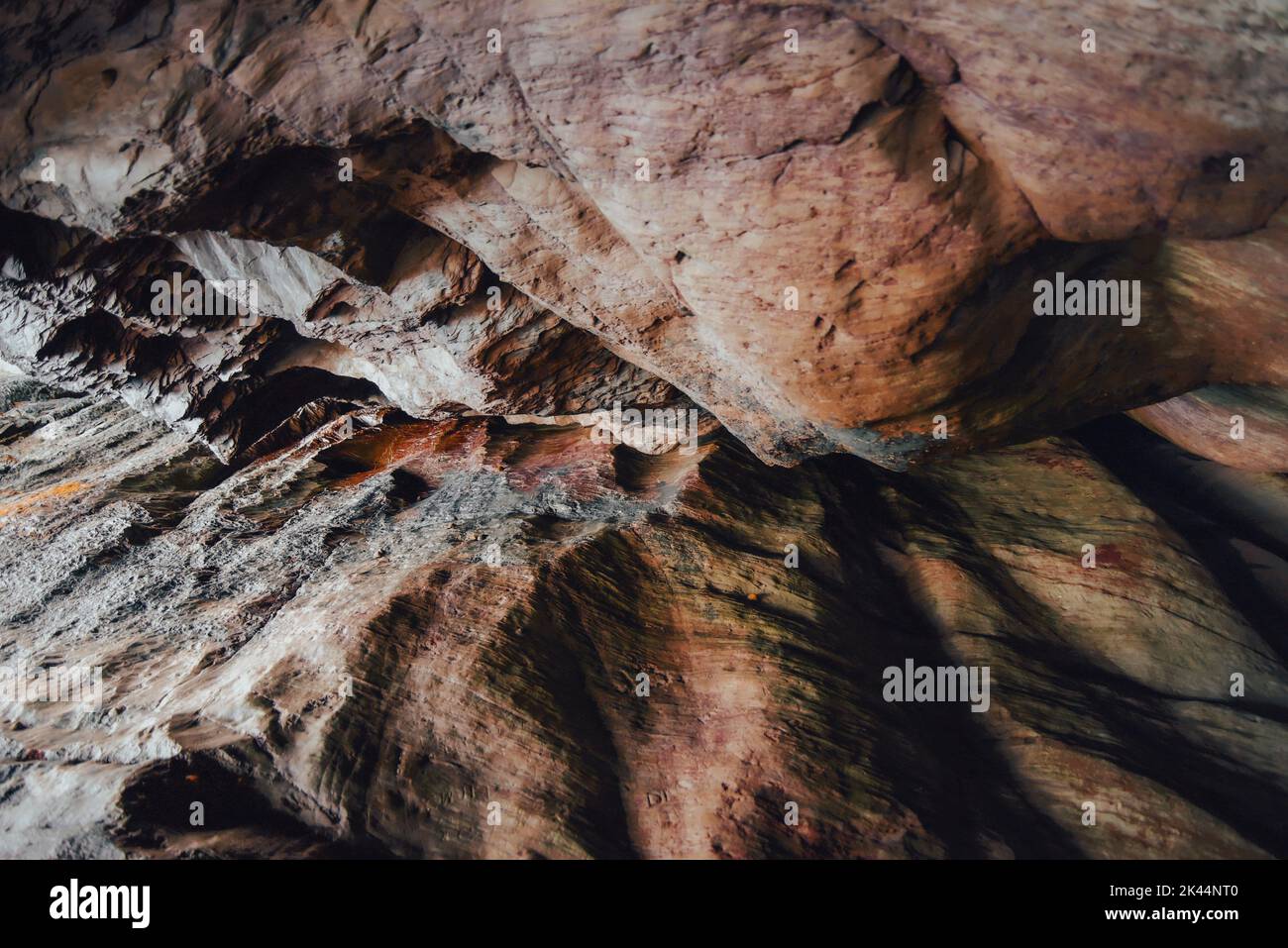 Sedimentary cave entry, abstract colour background Stock Photo - Alamy
