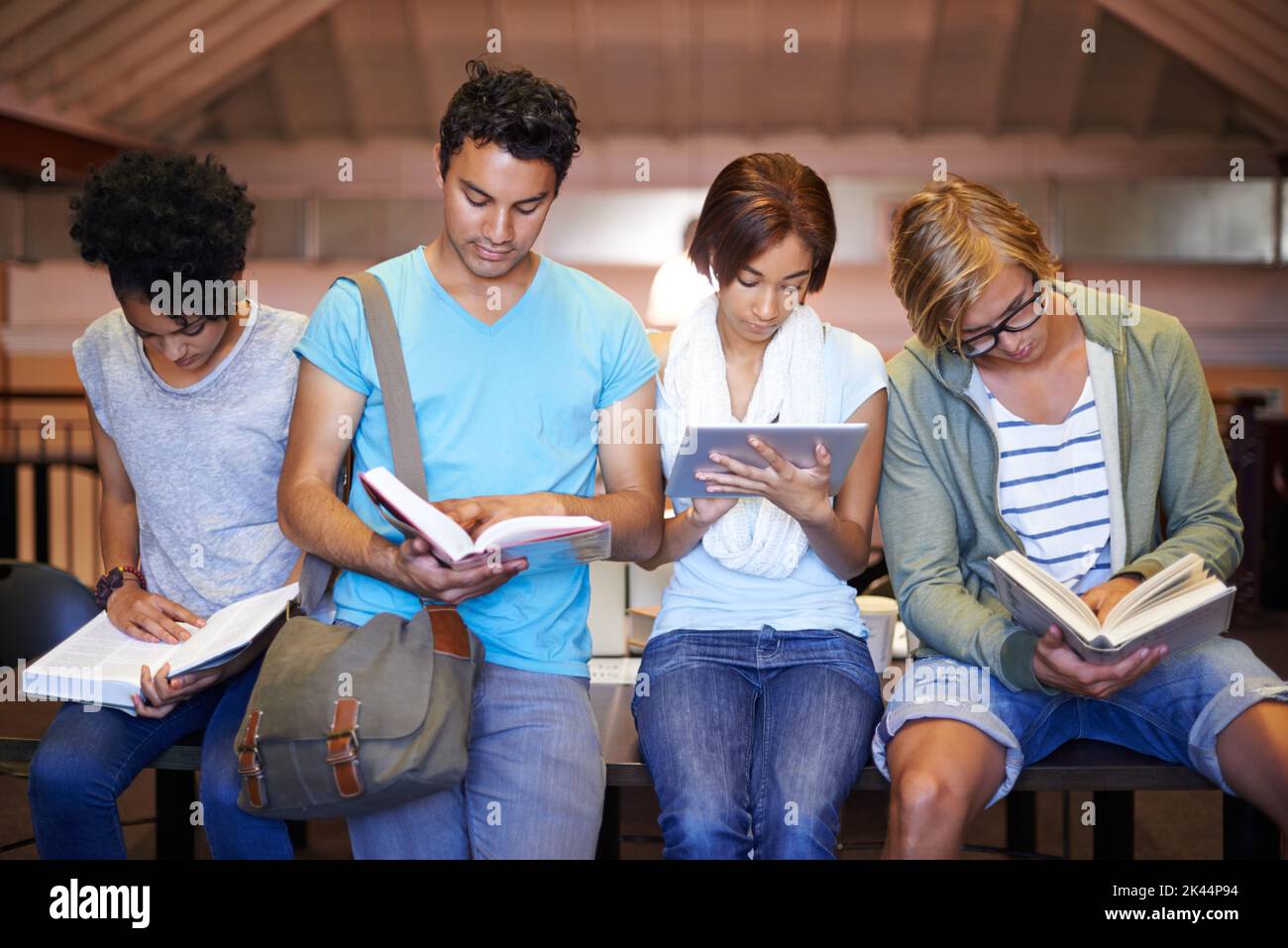 Studying together for exams. A group of young people studying together for the upcoming exams ...