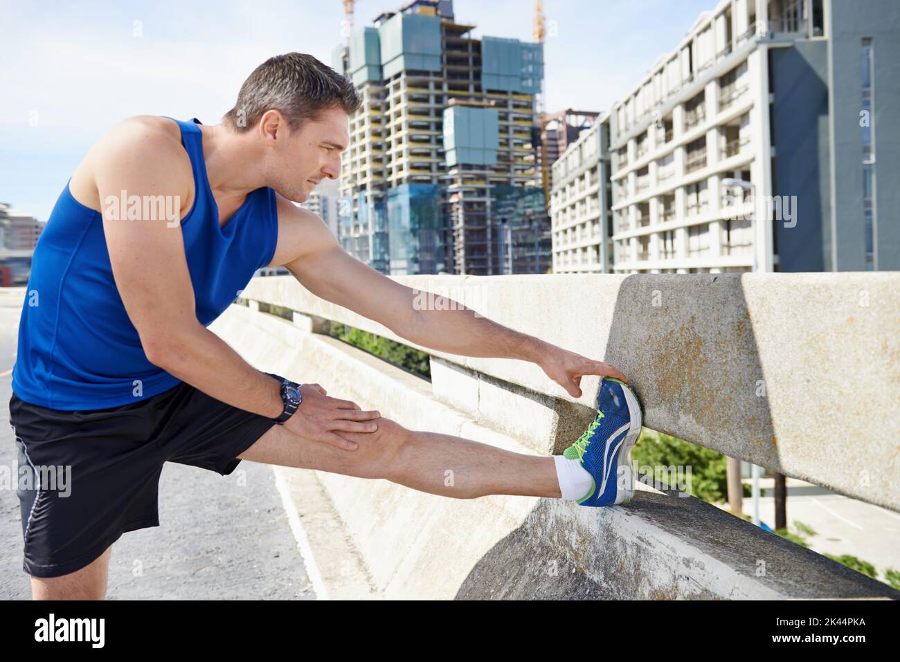 Just running into town. a sportsman running through the city streets ...