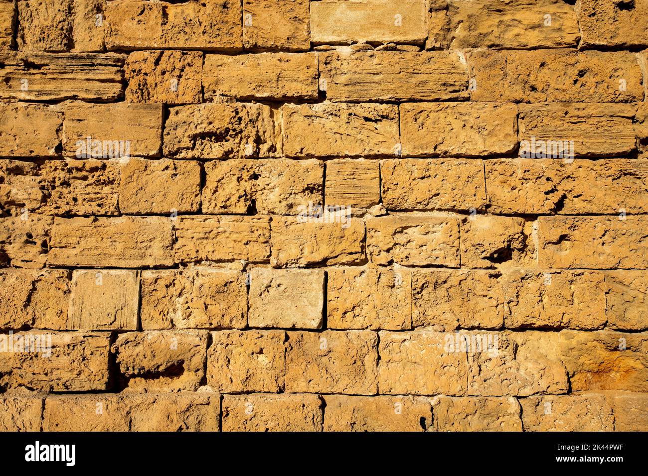 Wall made with rustic stone blocks, typical construction of the ...
