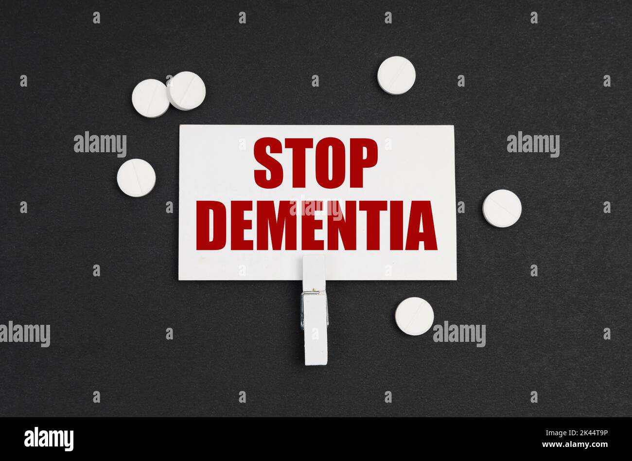 Medicine concept. On a black background, there are pills and a business ...