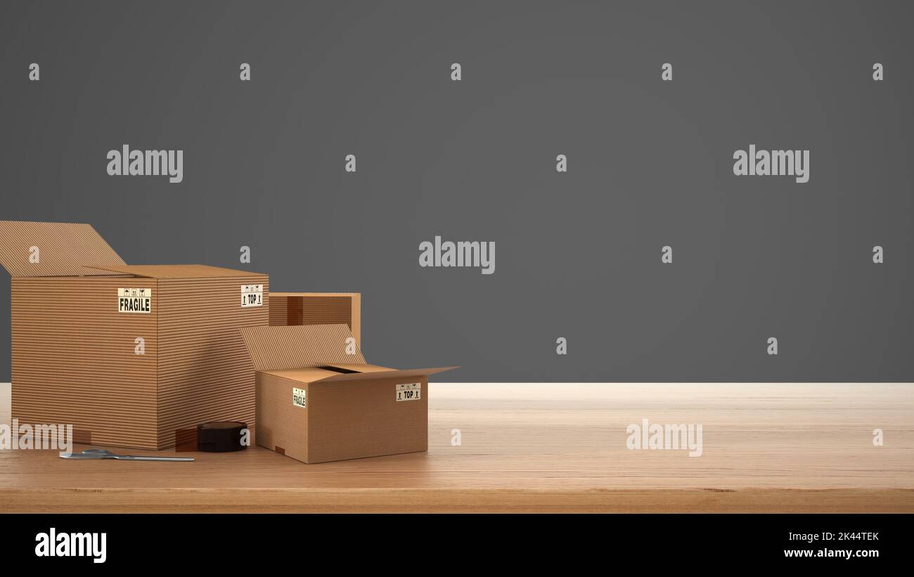 Wooden table, desk or shelf with stack of cardboard boxes over gray ...