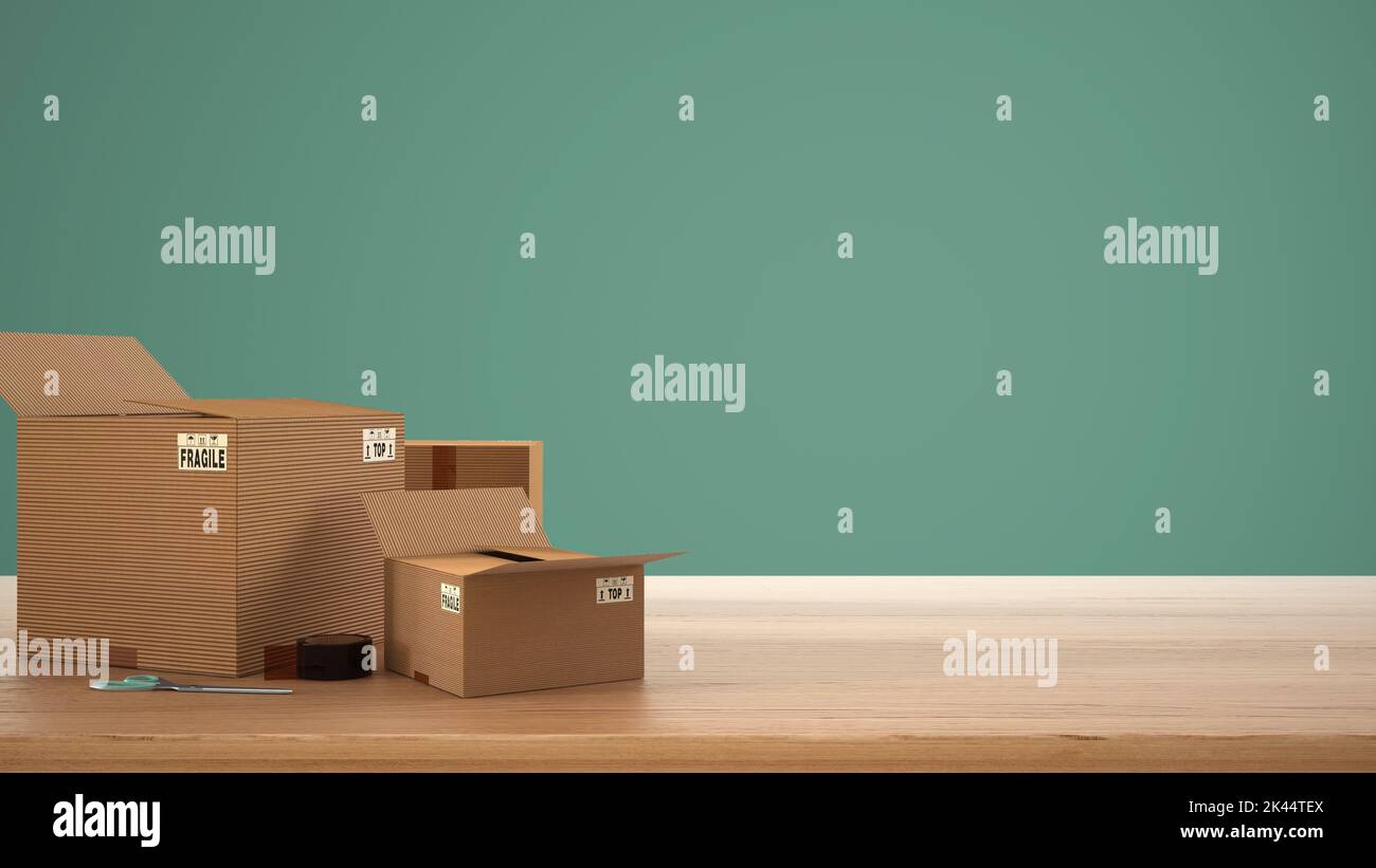 Wooden table, desk or shelf with stack of cardboard boxes over ...