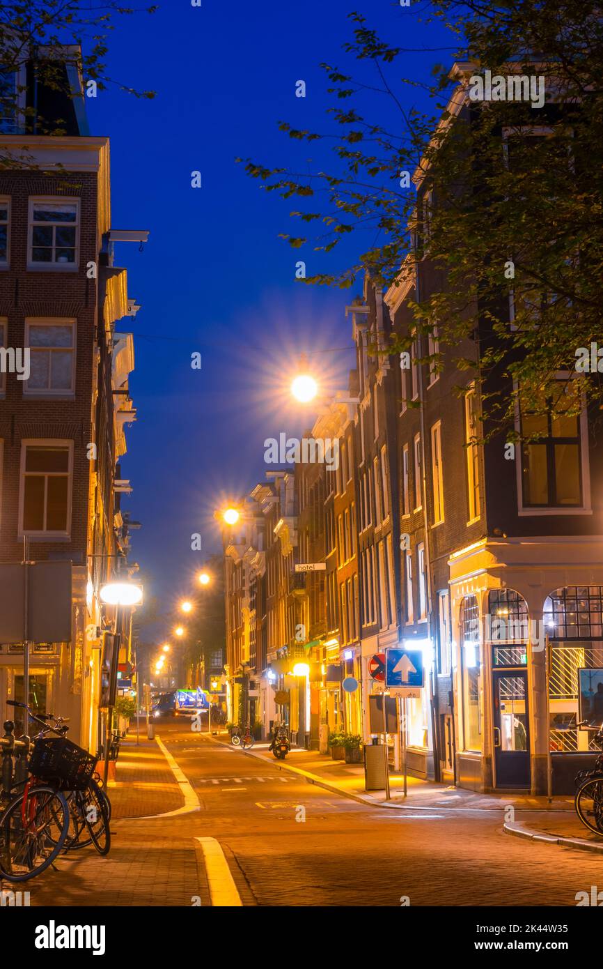 Netherlands. Summer night in downtown Amsterdam. Empty street with ...