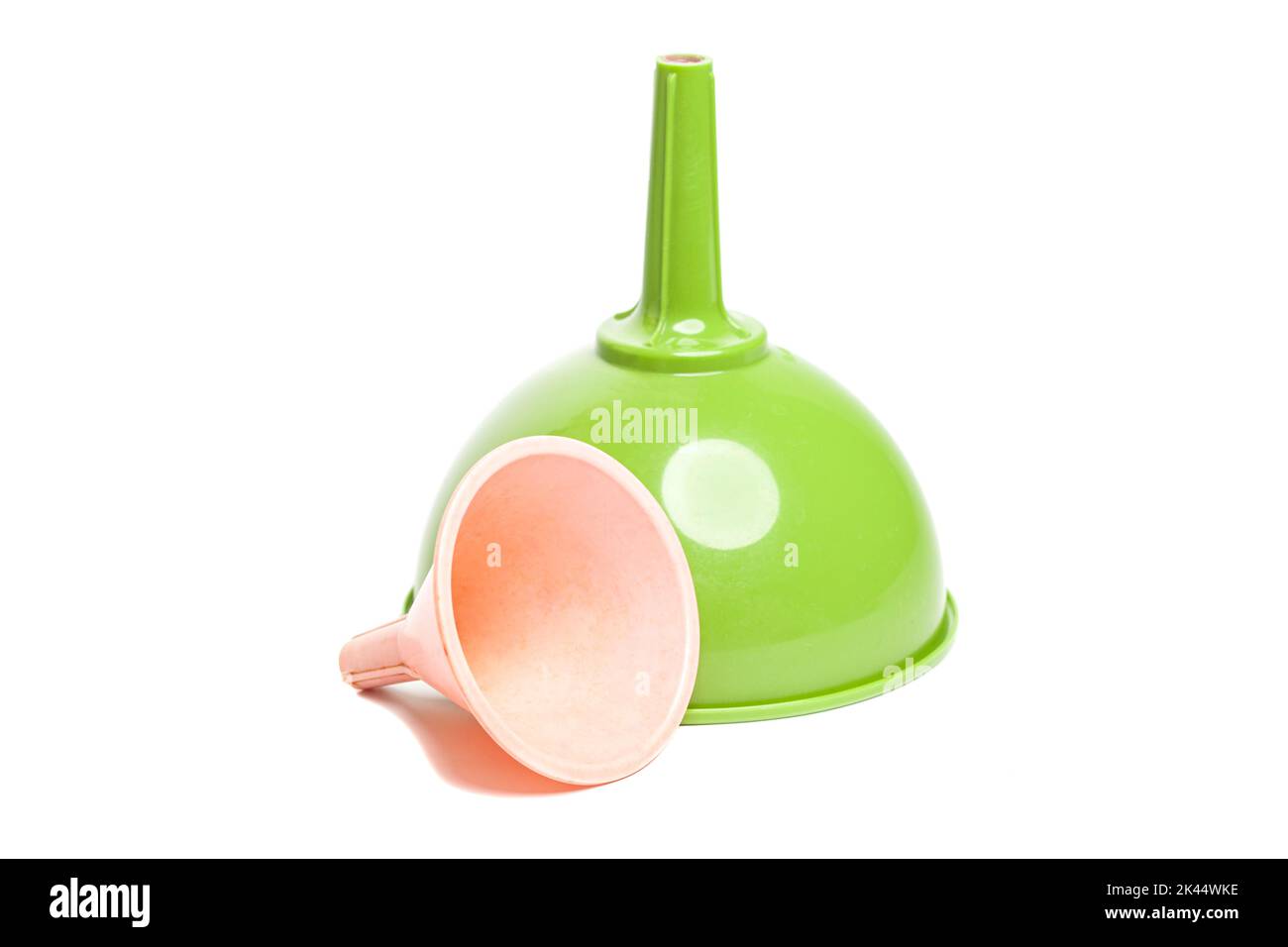 Green plastic funnels isolated on white Stock Photo - Alamy