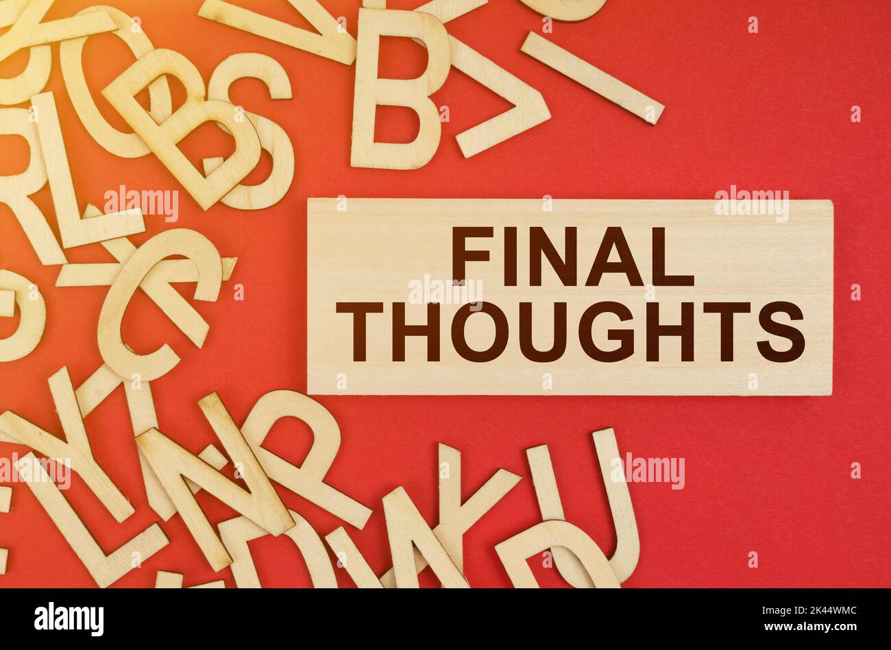 Business and finance concept. On a red background, there are wooden ...