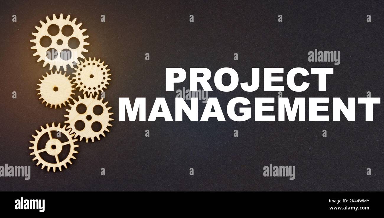 Business and industry concept. On a black background, gears and the ...