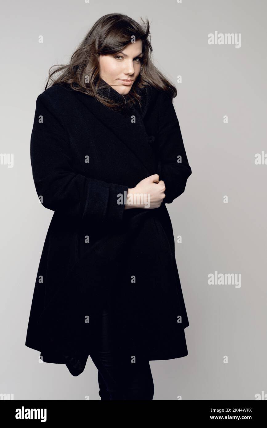 Get ready for Autumn. Studio shot of a plus-size model posing for the ...