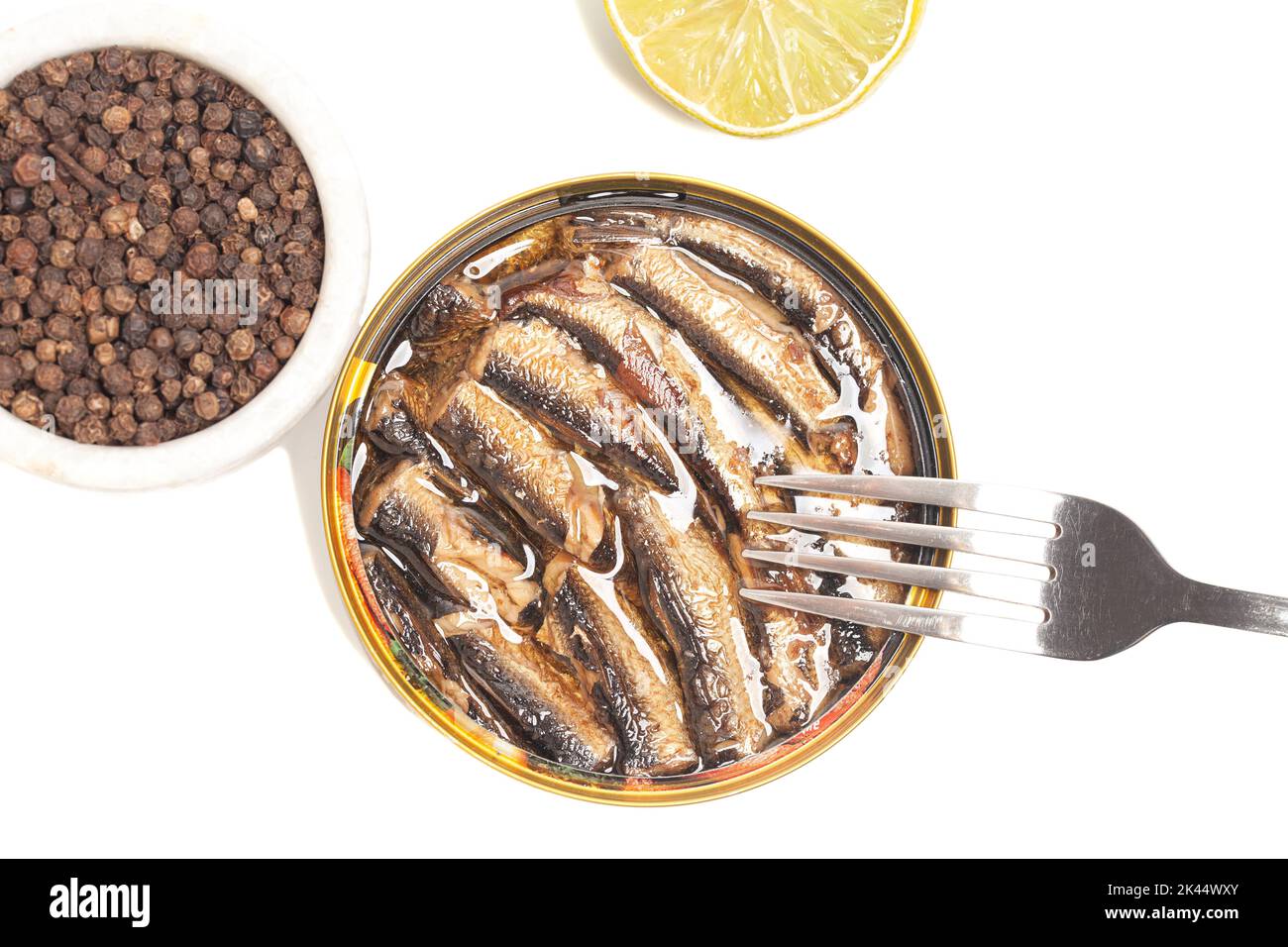 canned smoked sprats in oil with spices and lemon top view Stock Photo ...