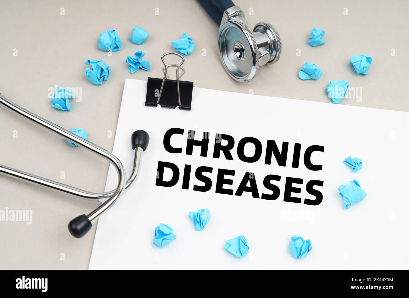 Medicine concept. On the table is a stethoscope, a pen, blue crumpled ...