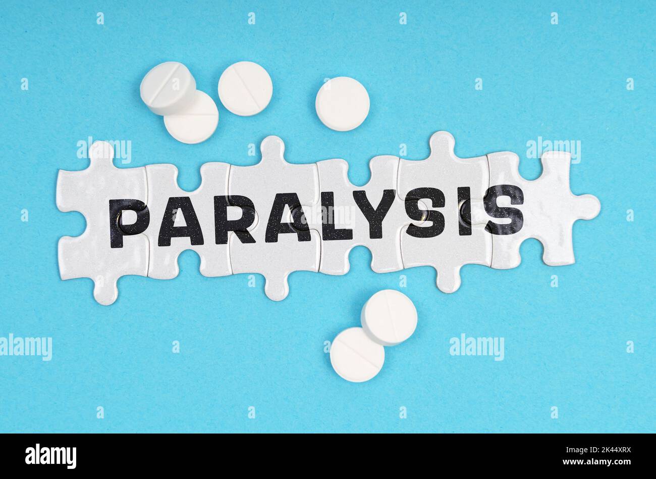 Medicine concept. On a blue background pills and puzzles with the ...