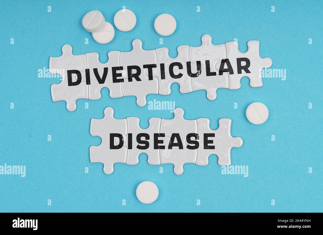Medicine concept. On a blue background pills and puzzles with the ...