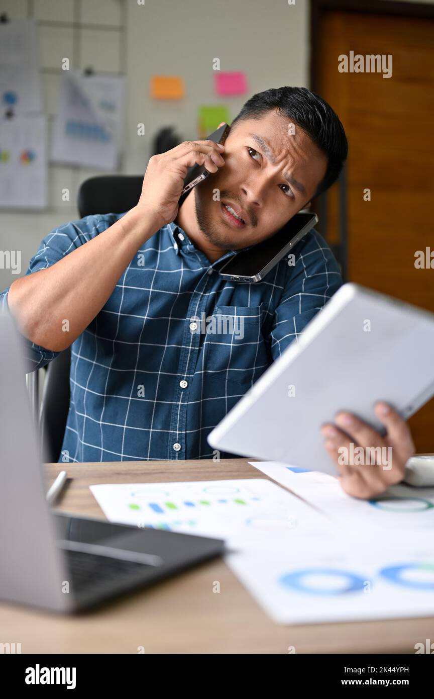 Portrait, Busy and hardworking Asian businessman or male office worker ...