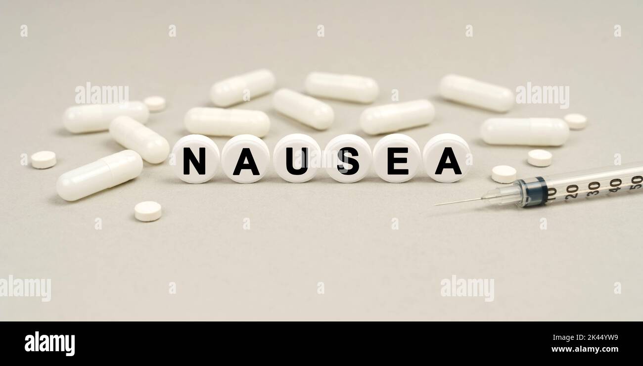 Medicine concept. On the table are capsules, a syringe and pills that ...