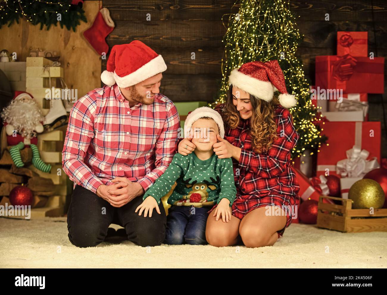 Winter holidays. Christmas tradition. Father mother little son ...