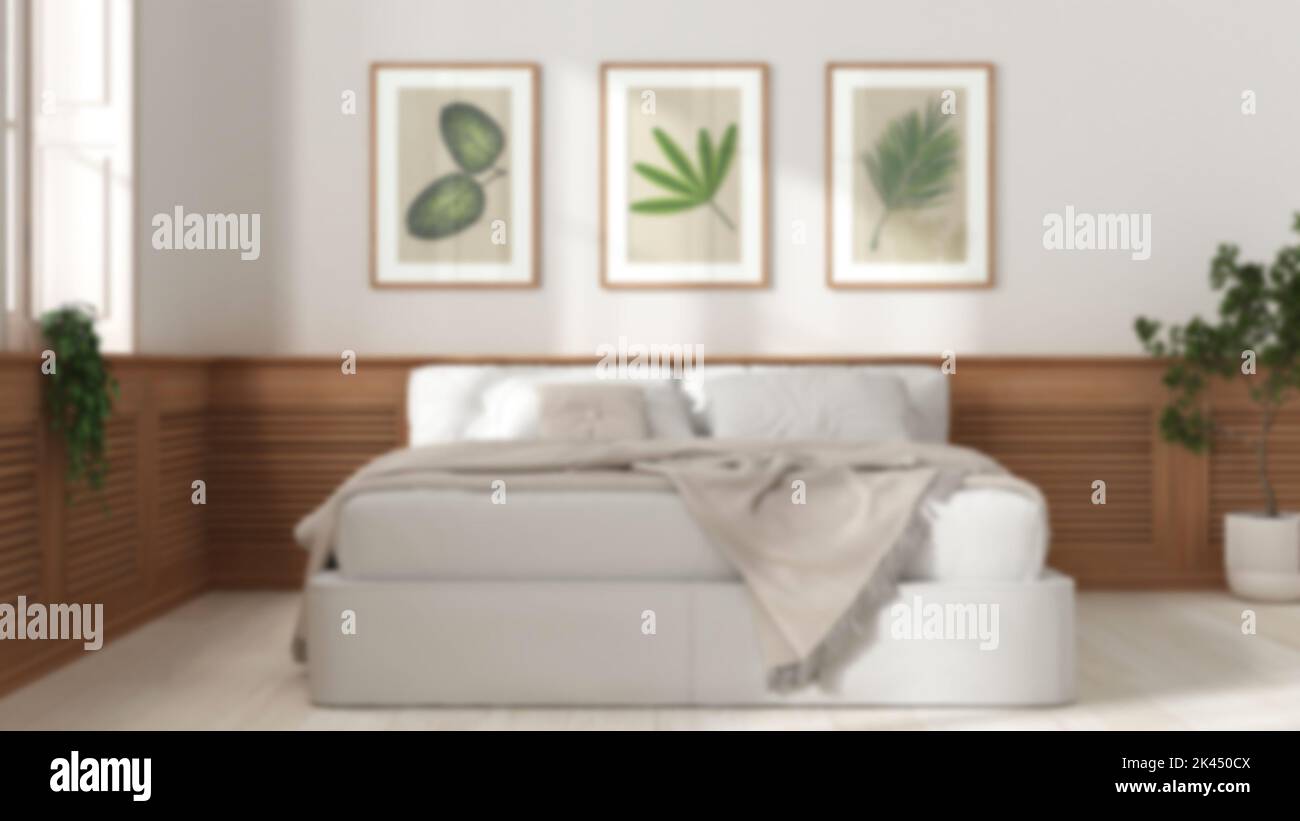 Blurred background, modern bedroom. Bed, wooden wall panel with ...