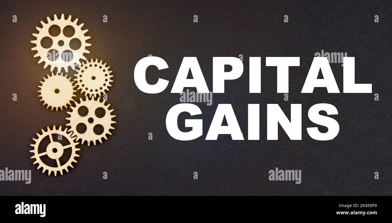 Business and industry concept. On a black background, gears and the ...