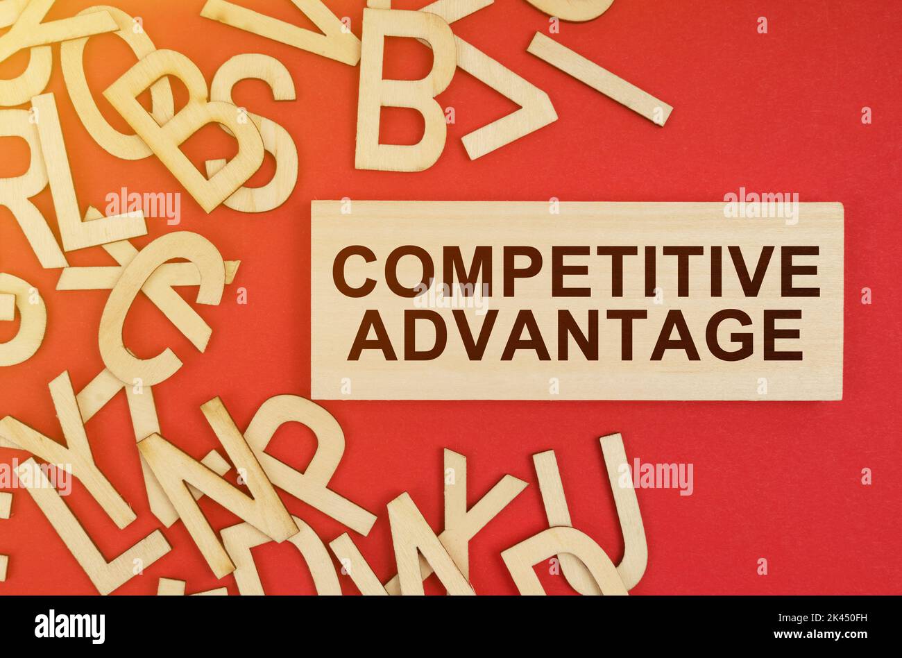 Business and finance concept. On a red background, there are wooden ...