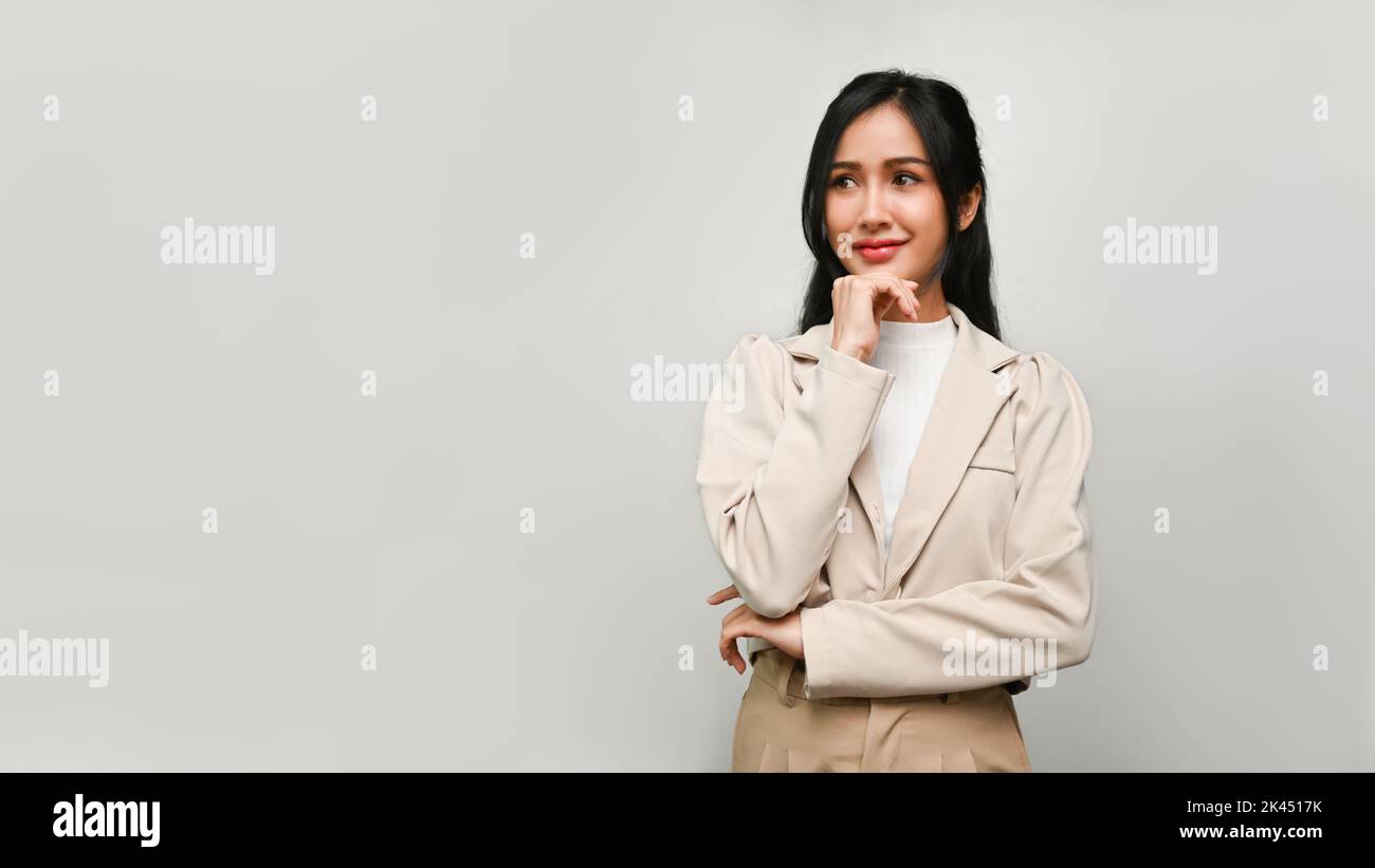 Confident millennial Asian female or businesswoman in casual suit ...