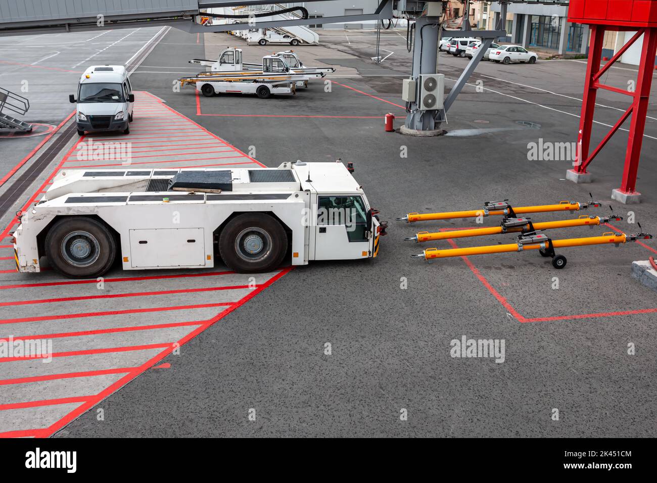 Aircraft tow tractor near towbars, self-propelled conveyor belt loaders ...