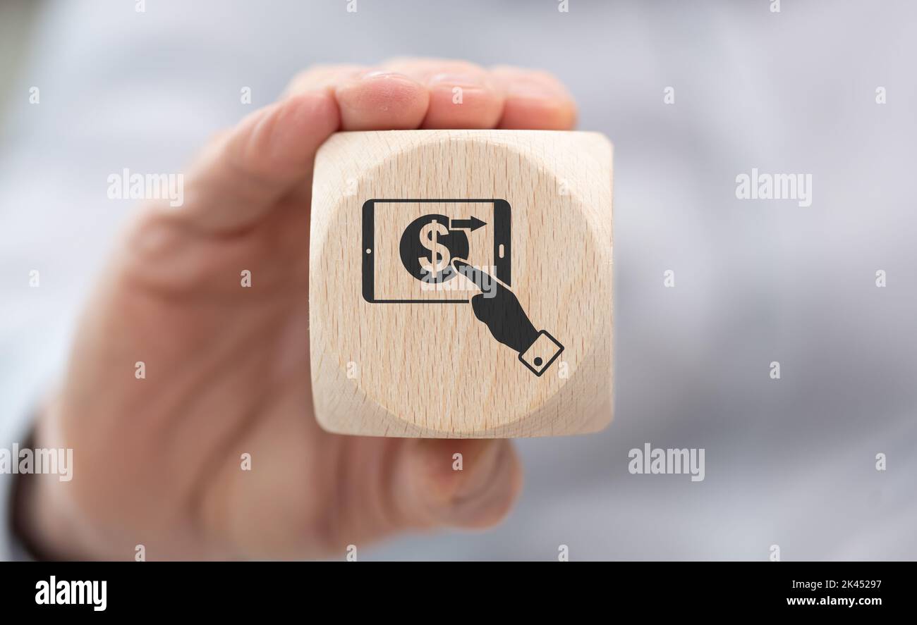 Hand holding a wooden cube with symbol of mobile payment concept Stock ...