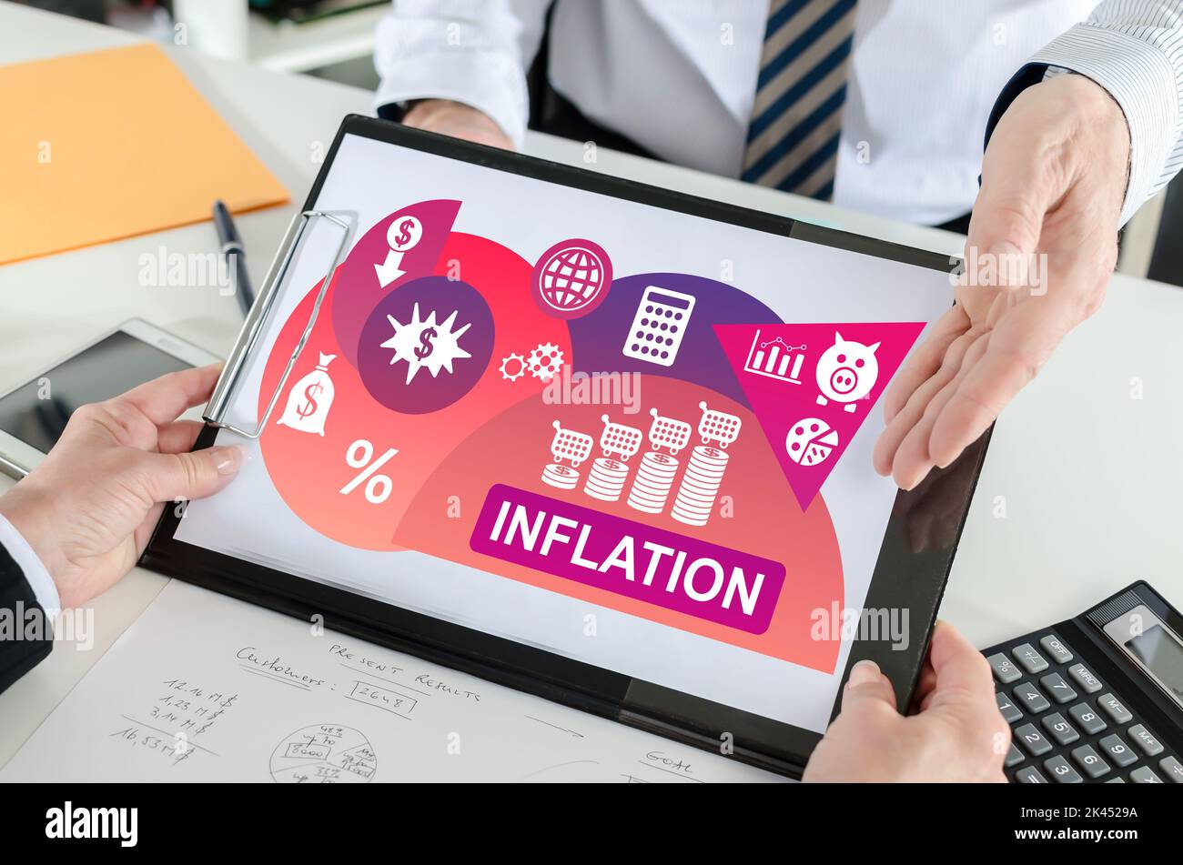 Inflation concept shown by a businessman Stock Photo - Alamy