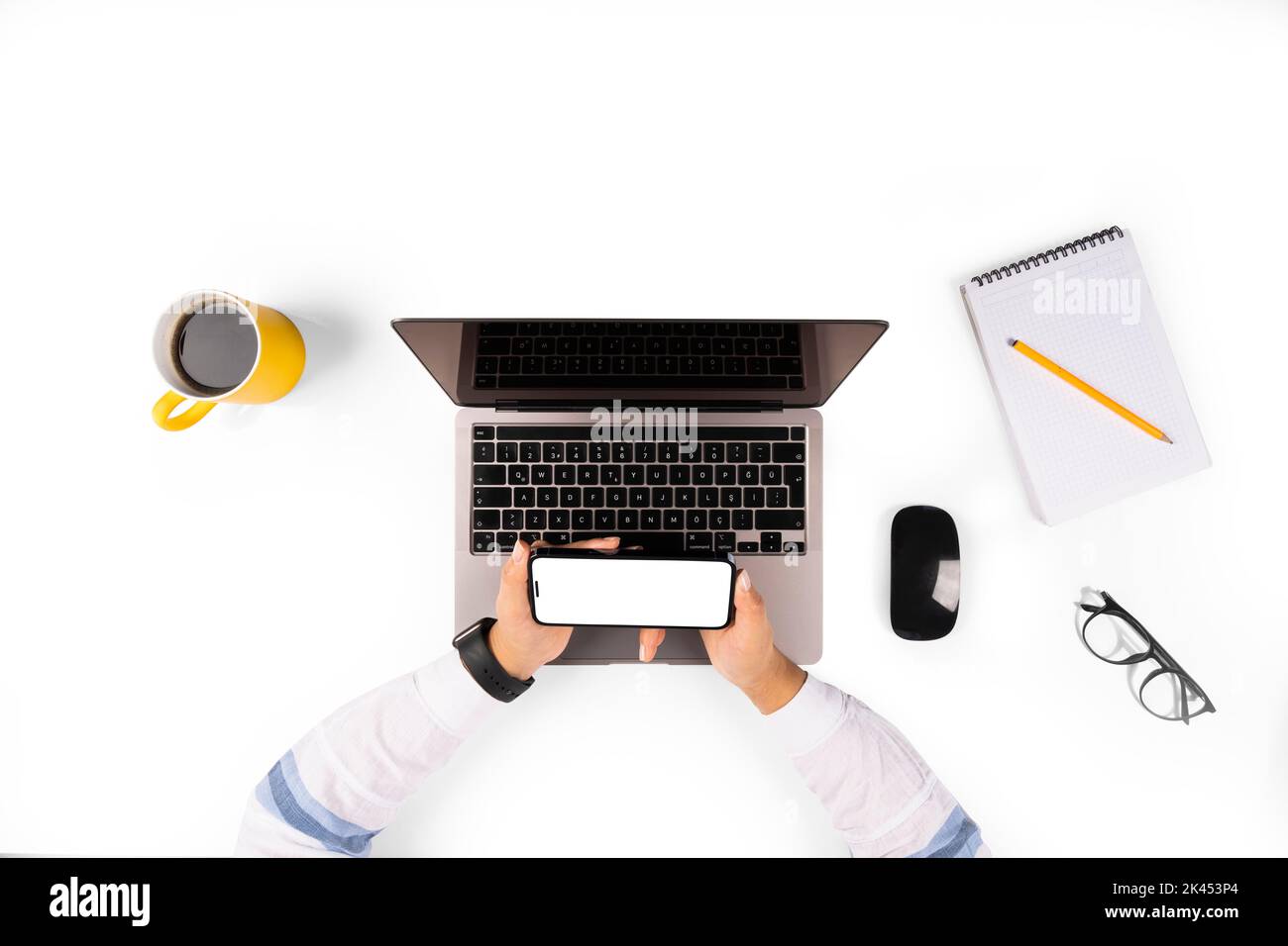 Horizontal smartphone mock up, top view of office worker holding ...