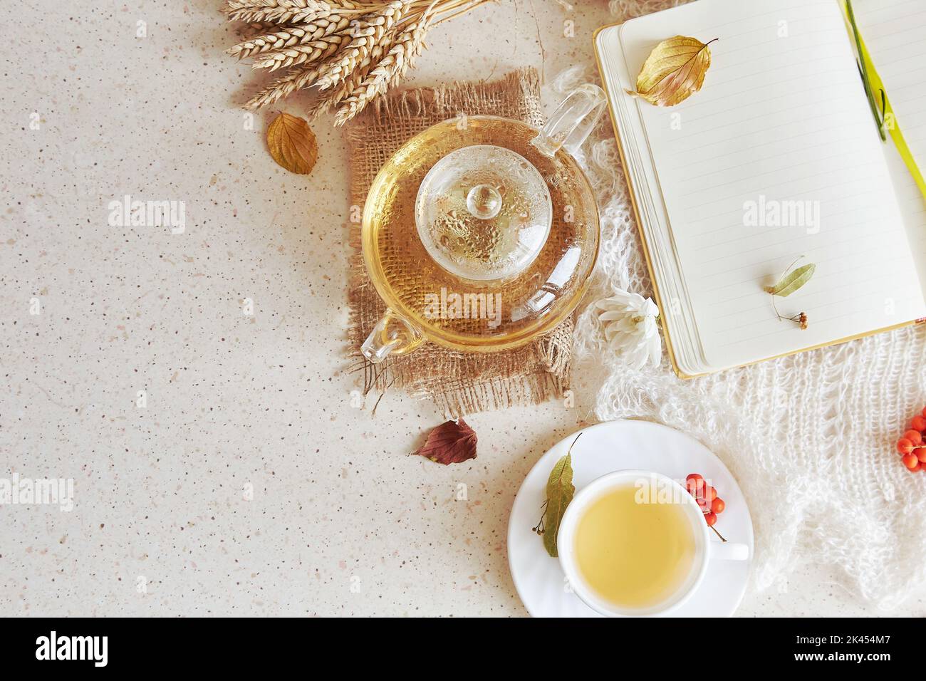 Autumn aesthetic organic linden tea in teapot with cup of tea. Dry ...