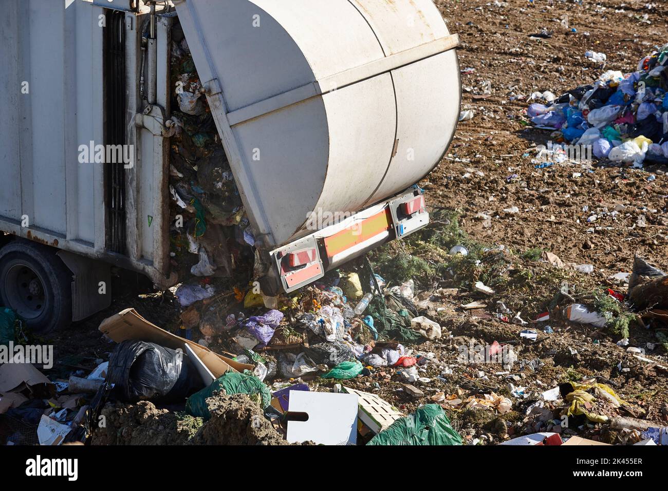 Truck unloading garbage on an open air dump. Waste recycling Stock ...