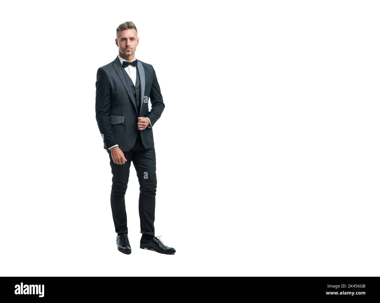 businessman in tuxedo suit with neck bow isolated on white background ...
