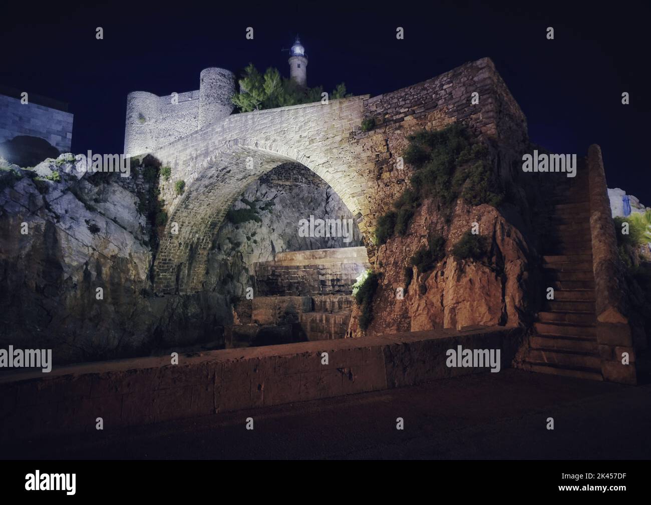 The Medieval bridge in Castro Urdiales, Spain at night Stock Photo - Alamy