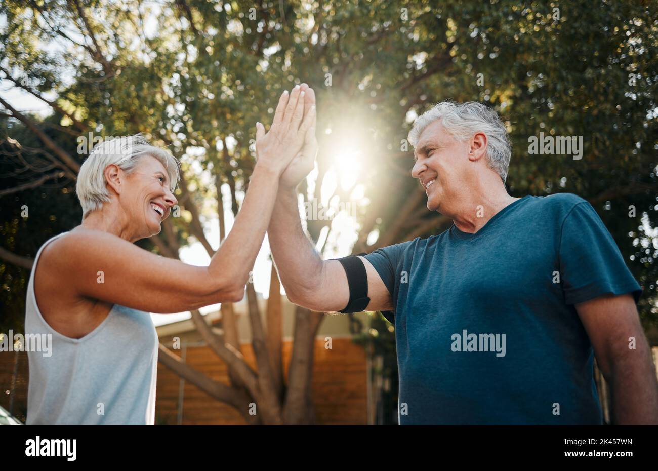 Fitness senior couple high five for support, teamwork and exercise ...