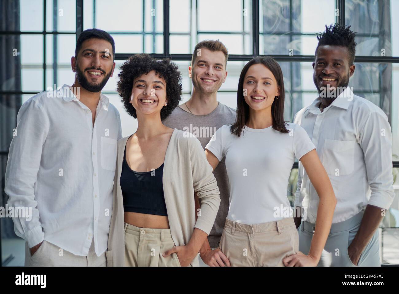 Smiling professional business leaders and employees group team portrait ...