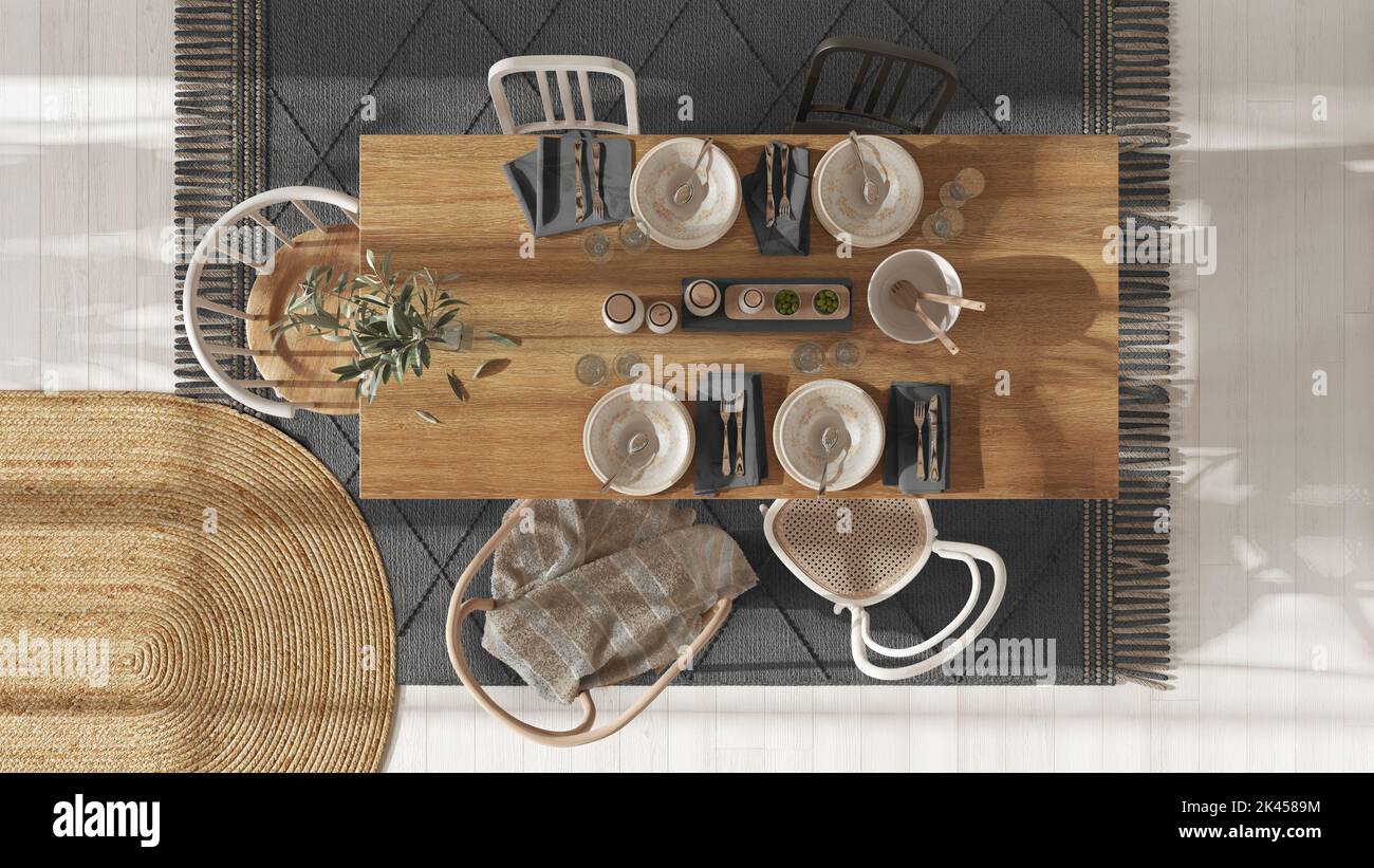Wooden country dining table with table setting in white and gray tones ...