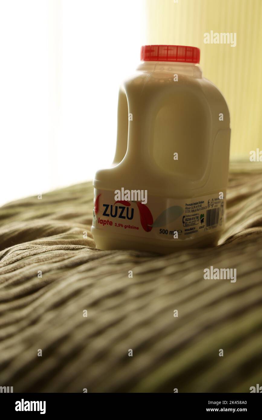 Plastic bottle (550 ml) of Zuzu milk (Romania) in a sunny environment ...