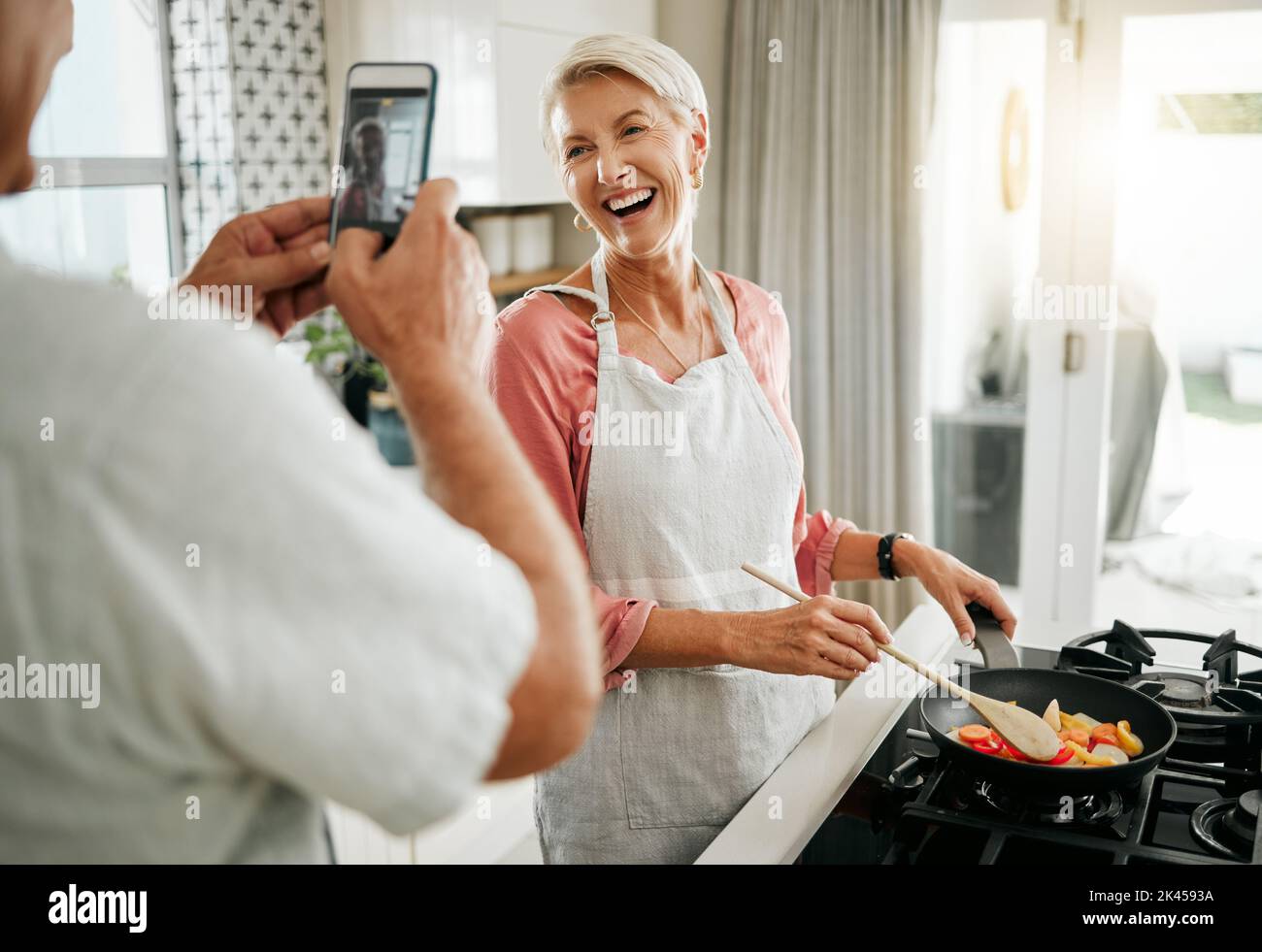 Phone, man and woman taking a picture and cooking healthy food for ...