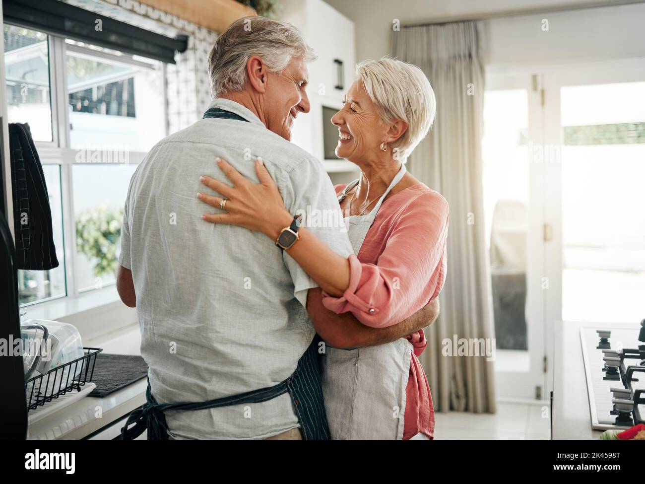 Cooking dance, dinner and senior couple dancing with smile while making ...