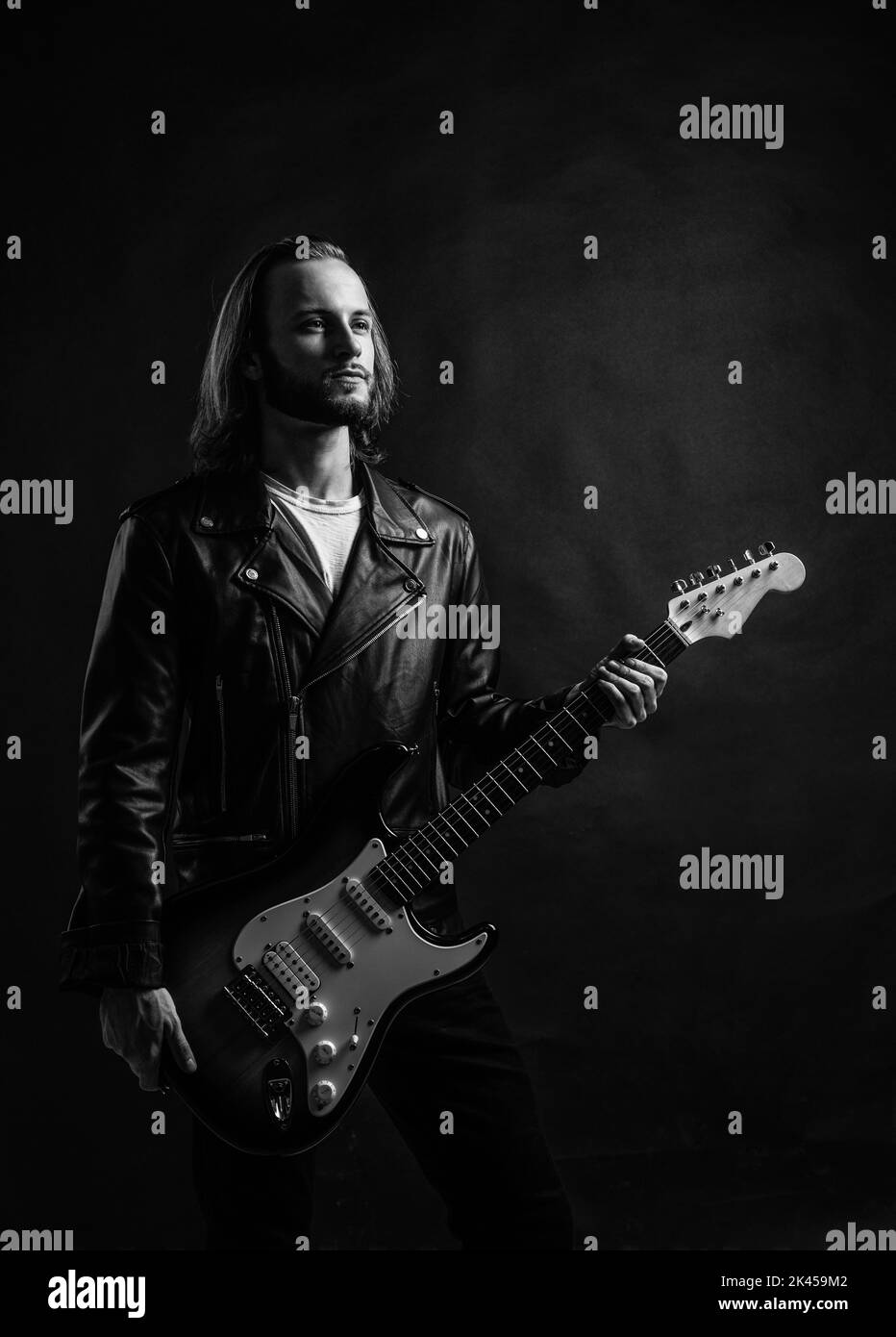 cool. masterfully playing rock music. stylish crazy man. string musical ...