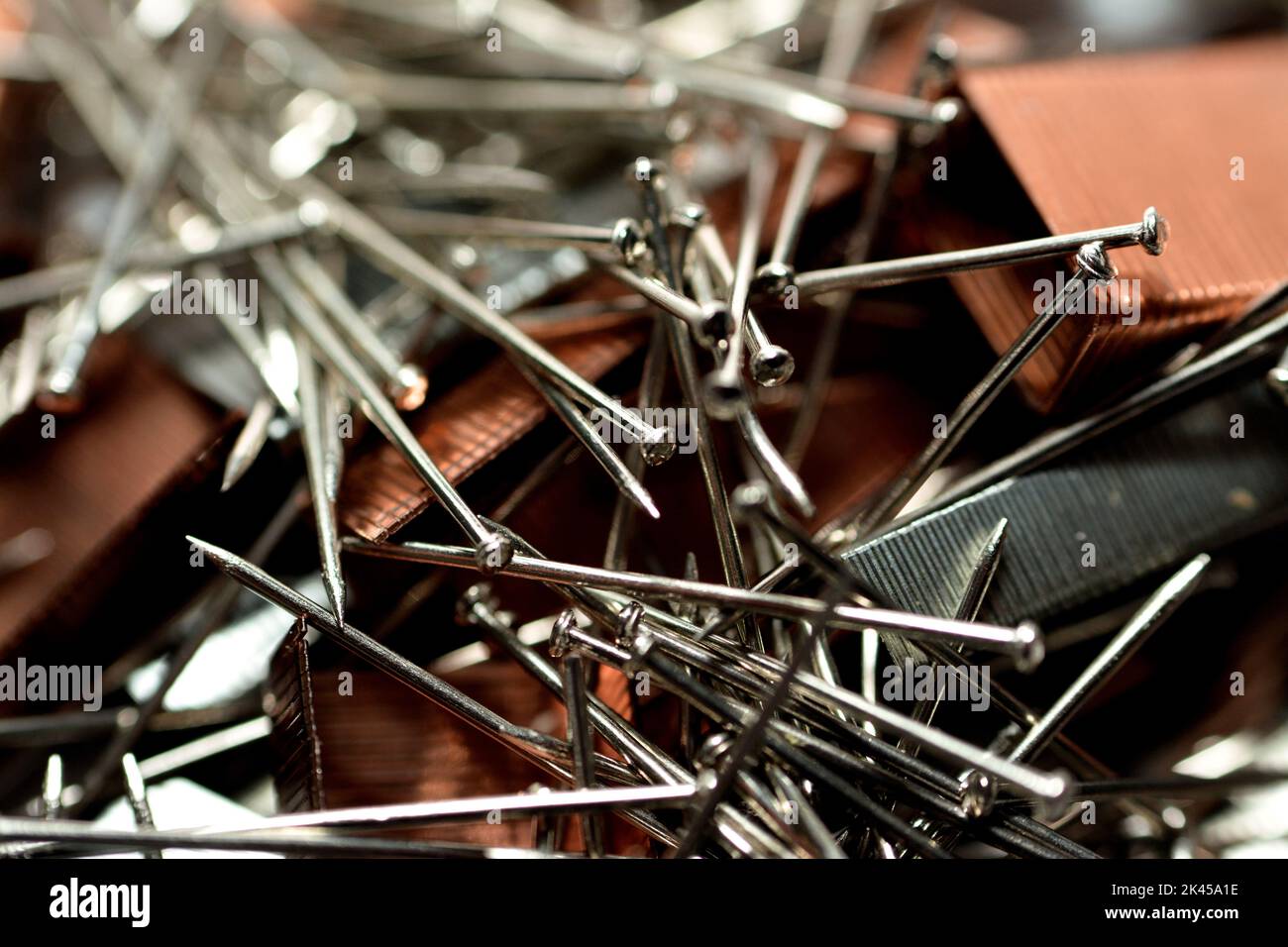 A pile of stapler staples and nickel-plated steel pins Stock Photo - Alamy
