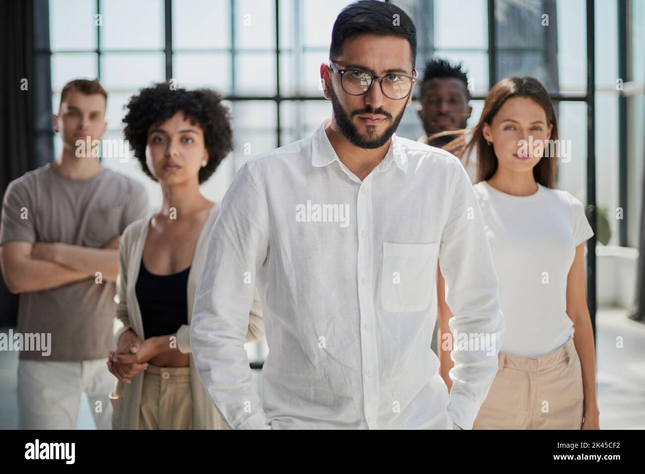 Smiling professional business leaders and employees group team portrait ...