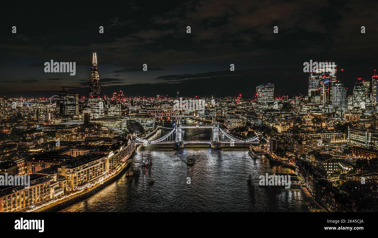 Aerial view of Tower Bridge and London City at night, London, United ...