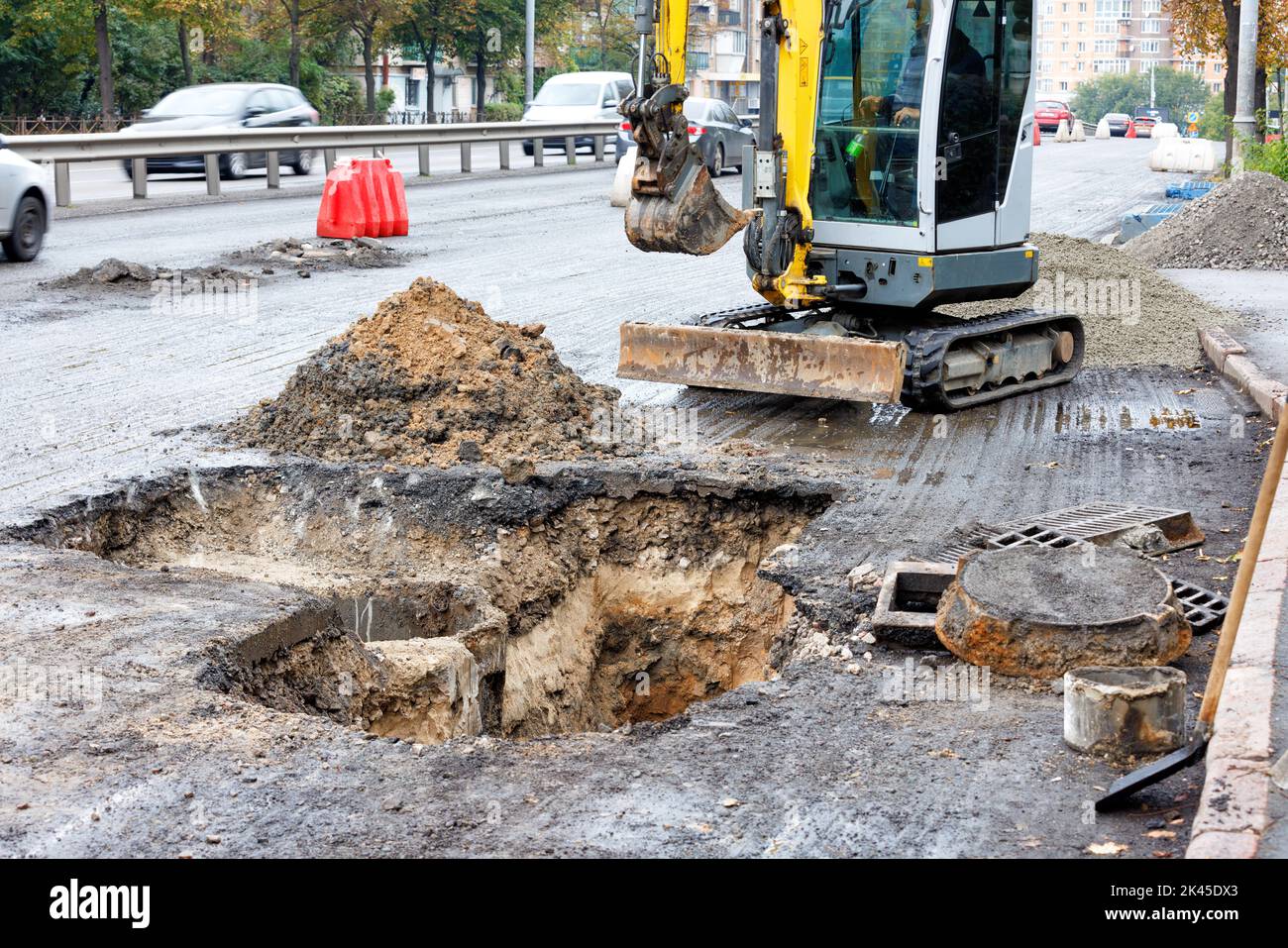 Small road equipment at work on the repair of urban sewer ...