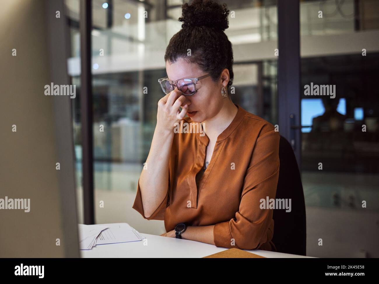 Stress, burnout and woman with a headache tired from working overtime ...