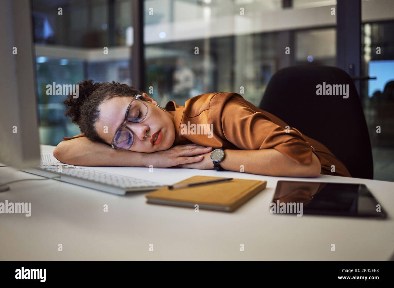 Stress, burnout and sleeping business woman in modern office, workplace ...