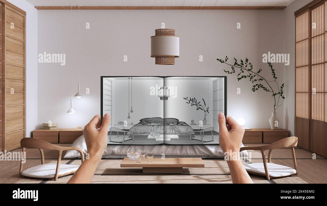 Hands holding notepad with japandi bedroom design blueprint sketch or drawing. Real interior ...